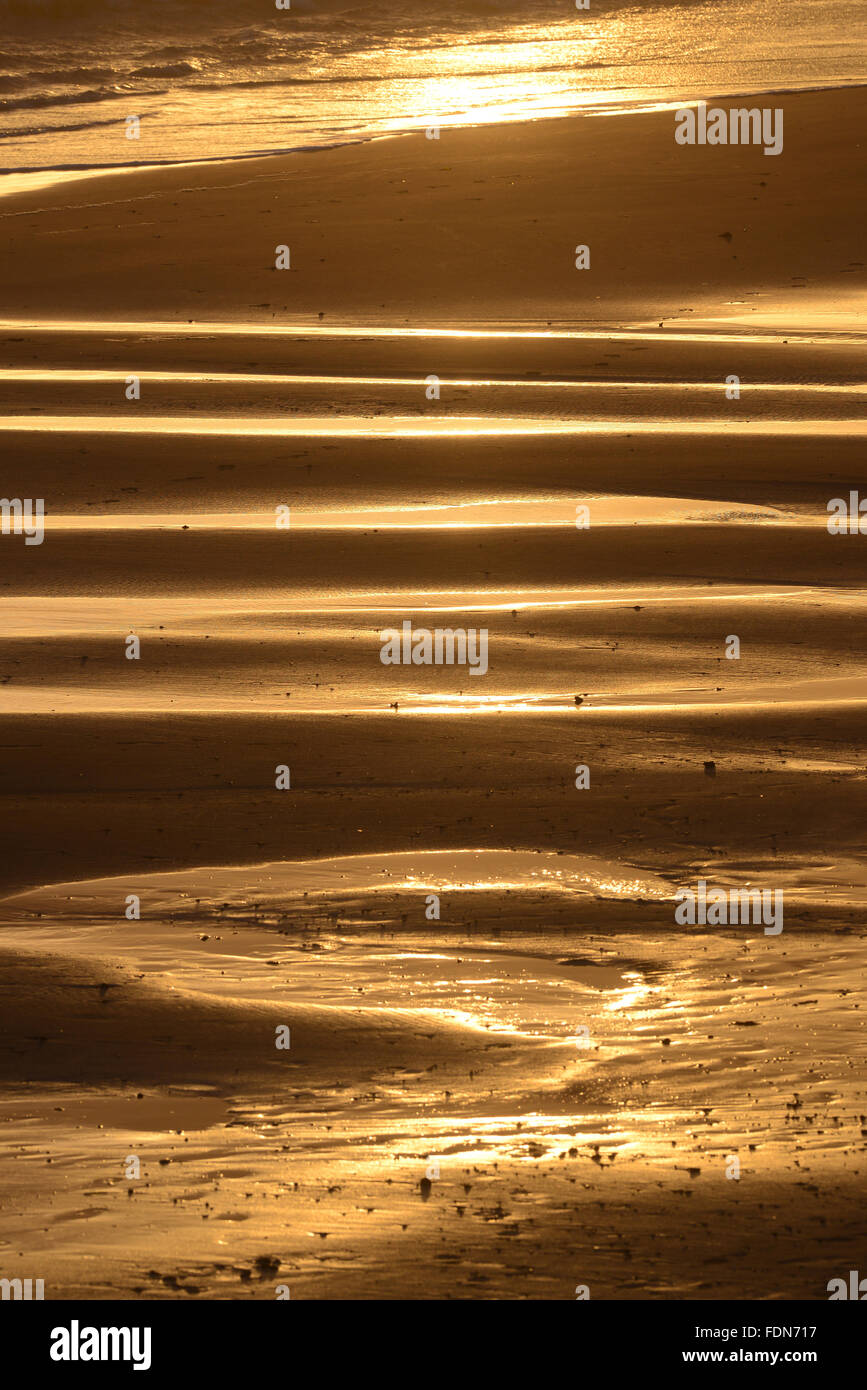 Sunset and ripple patterns on the sand at Bournemouth, UK, beach Stock ...