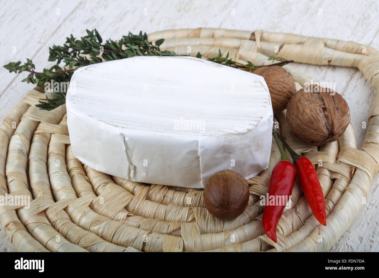 Brie cheese with thyme leaves and nuts Stock Photo - Alamy