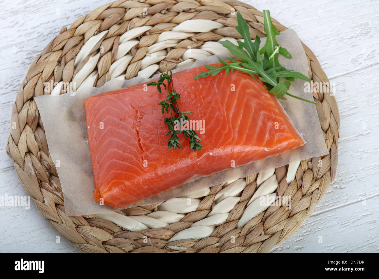 Salted salmon with thyme leaves on the wood background Stock Photo - Alamy