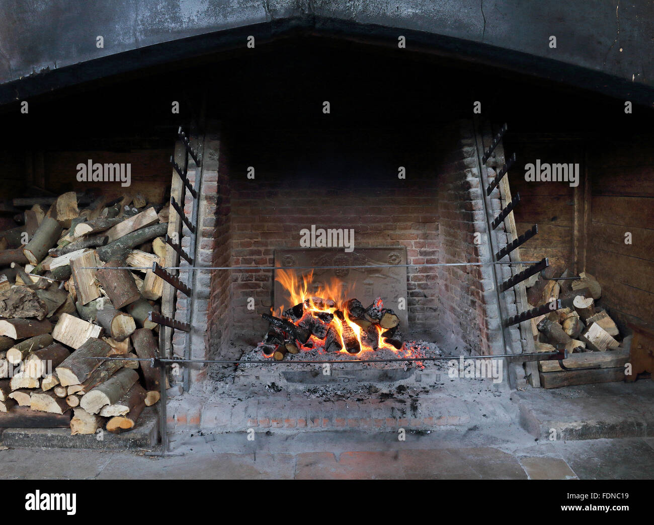 Blazing open Log fire in an Inglenook fireplace Stock Photo - Alamy