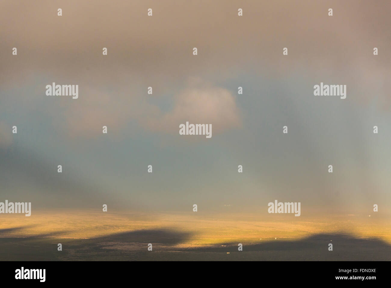 Storm clouds with morning shadows cast by the Organ Mountains over the ...