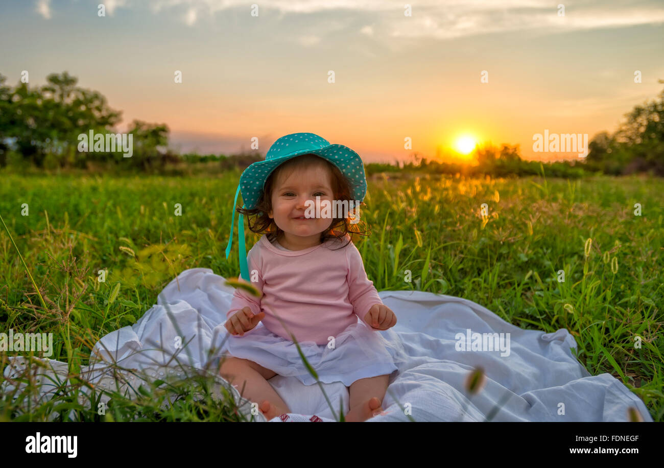 Beautiful girl sitting on meadow hi-res stock photography and images ...