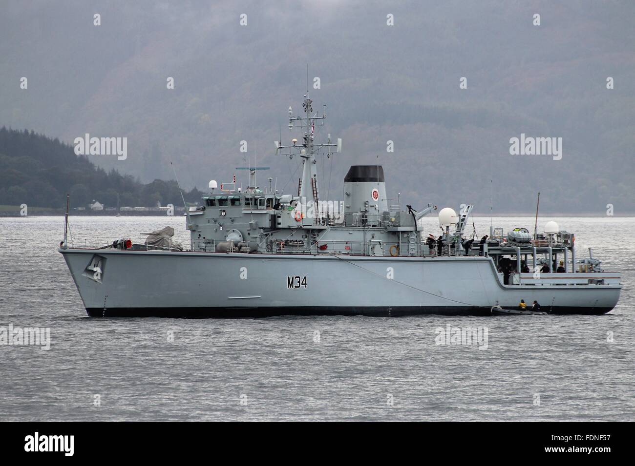 HMS Middleton (M34), a Hunt-class minehunter of the Royal Navy, passes ...