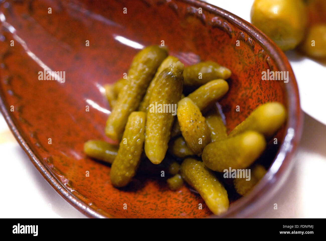 Pickled gherkins in a bowl / Cornichons Stock Photo - Alamy