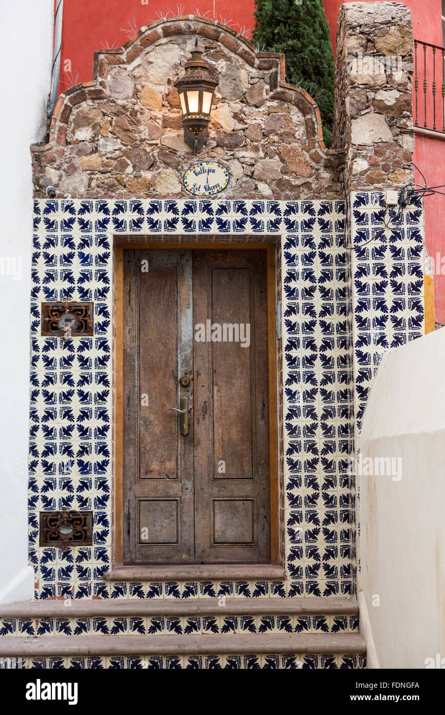 A traditional hacienda style wooden door and Spanish colonial tile on a ...