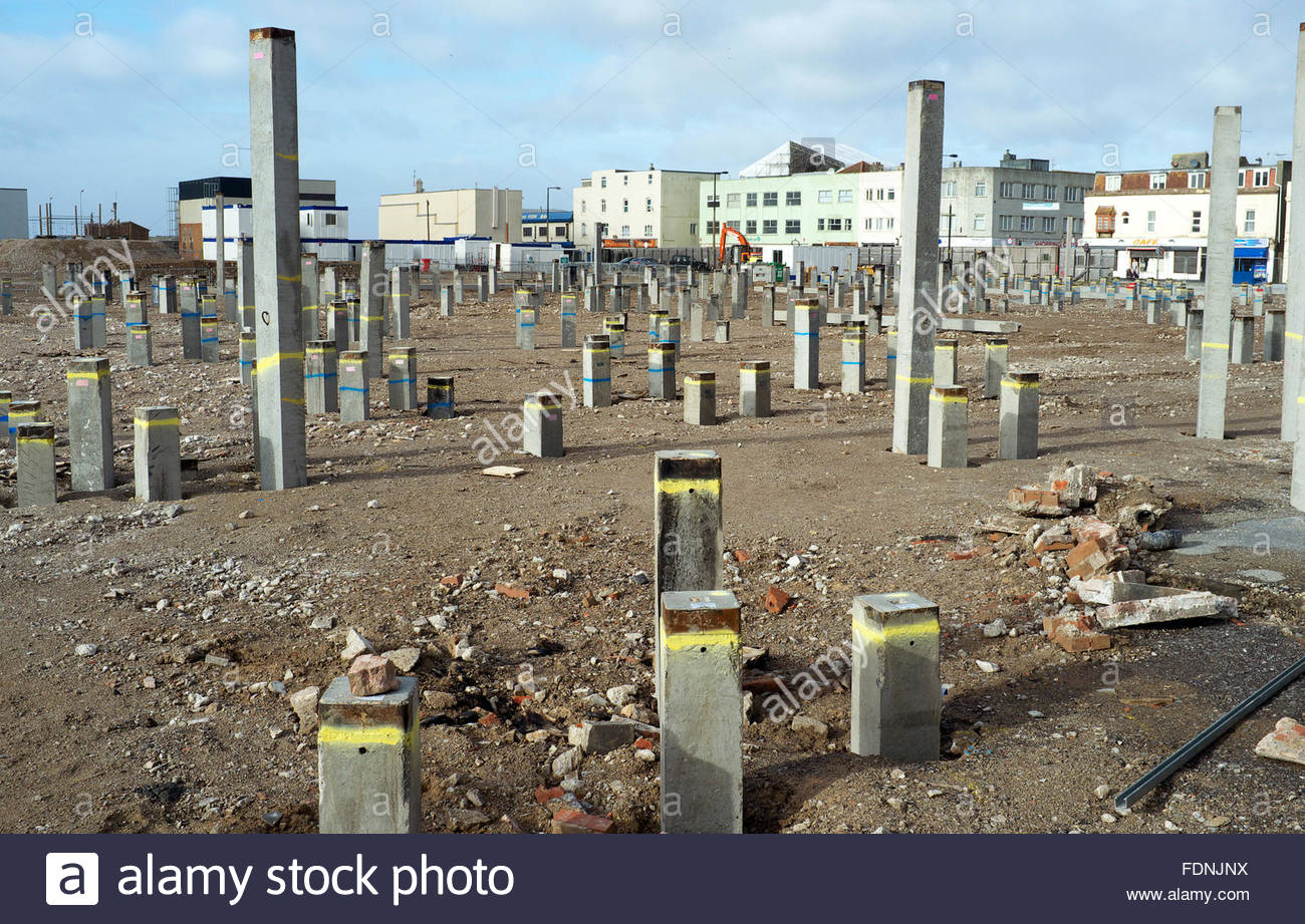 Concrete piles driven in to the ground for a deep foundation of a Stock ...