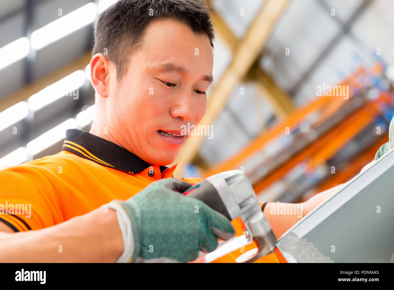portrait of asian worker in production plant working on the factory ...