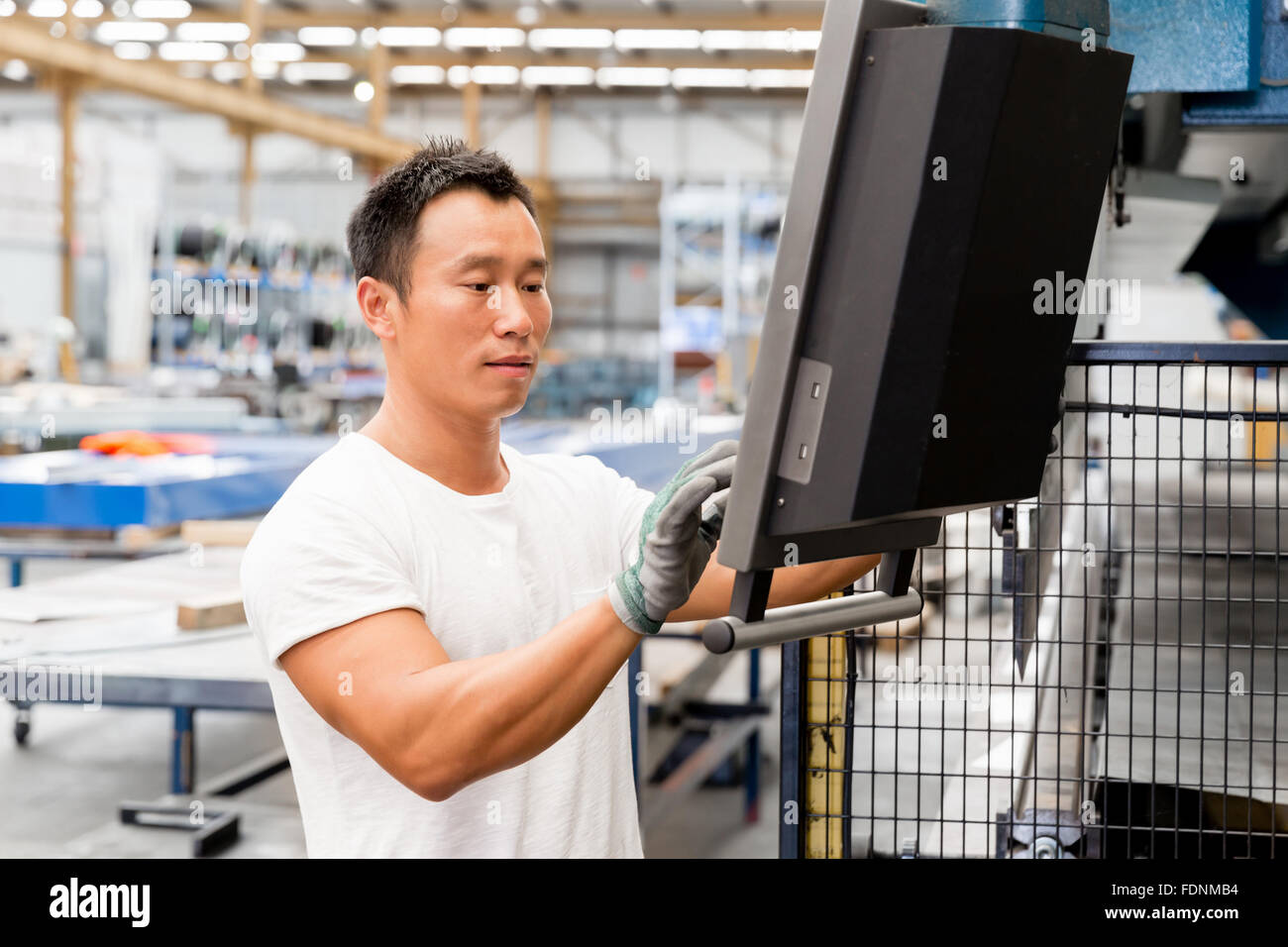 portrait of asian worker in production plant working on the factory ...