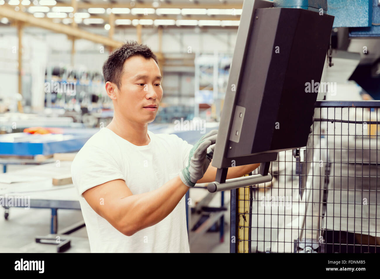 portrait of asian worker in production plant working on the factory ...