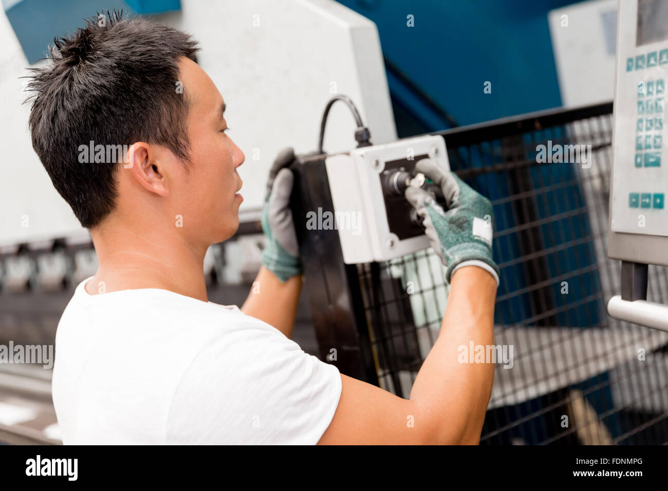 portrait of asian worker in production plant working on the factory ...