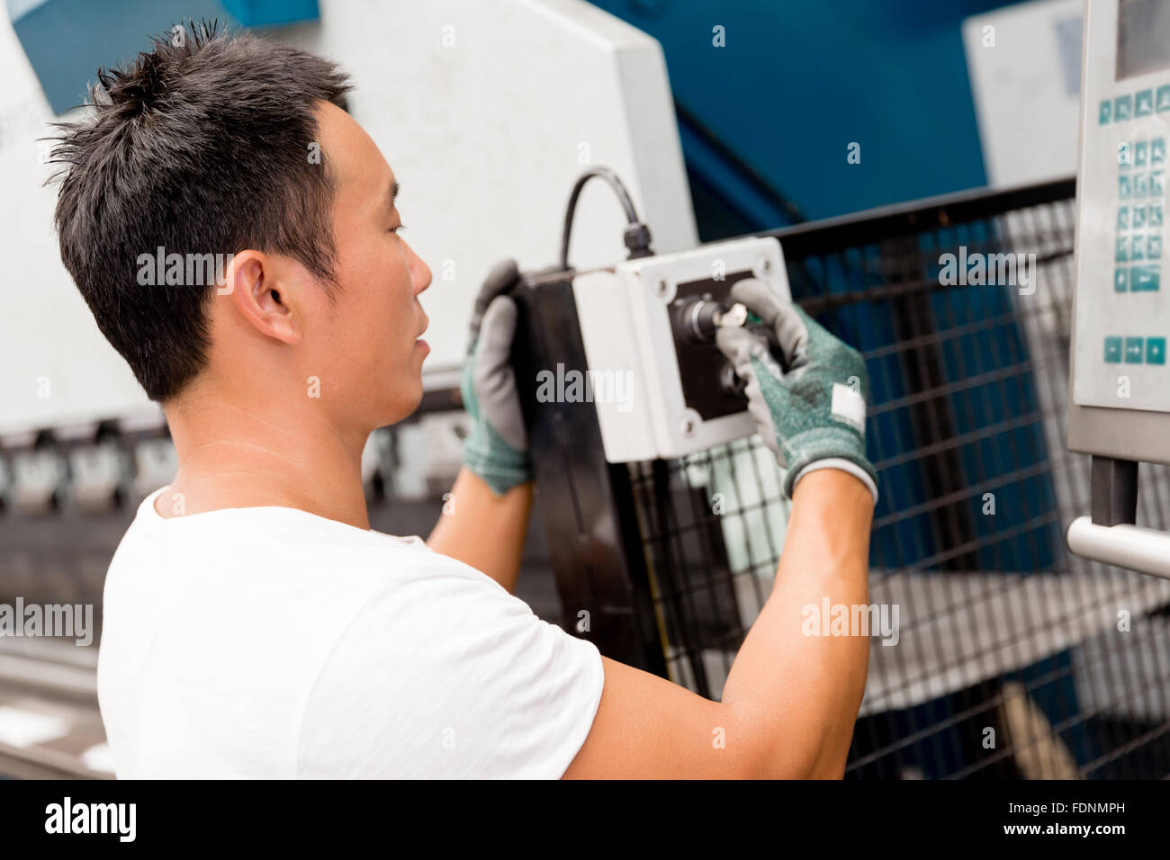 portrait of asian worker in production plant working on the factory ...