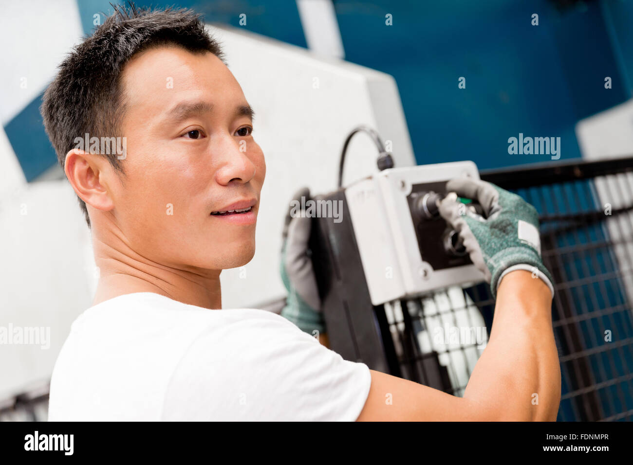 portrait of asian worker in production plant working on the factory ...