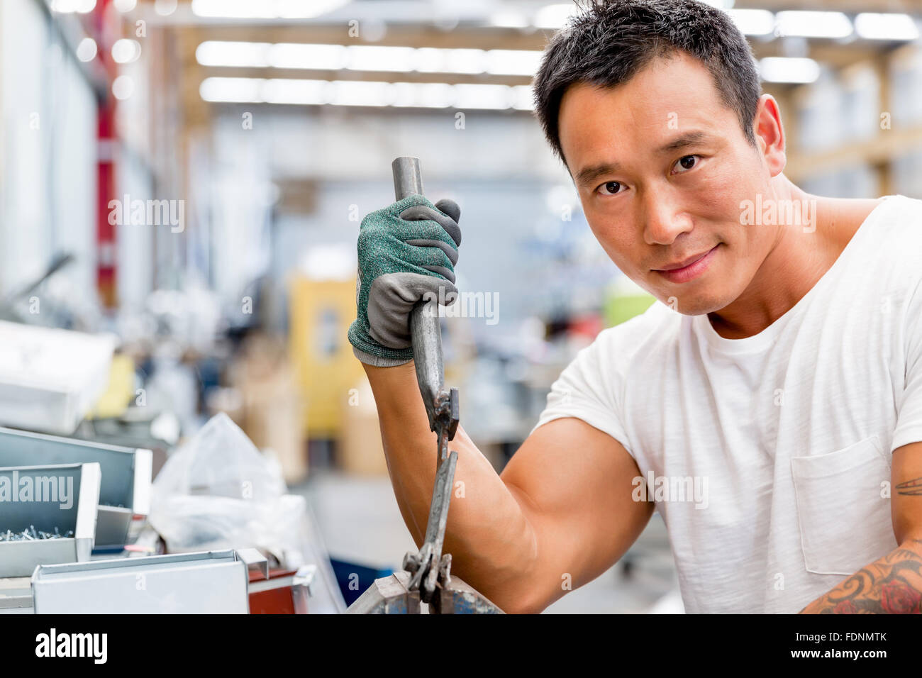 portrait of asian worker in production plant working on the factory ...