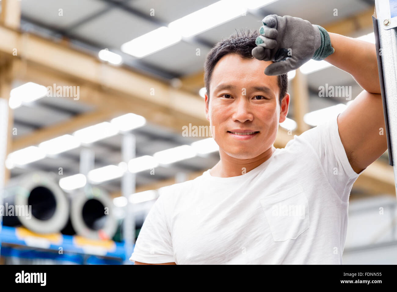 portrait of asian worker in production plant working on the factory ...