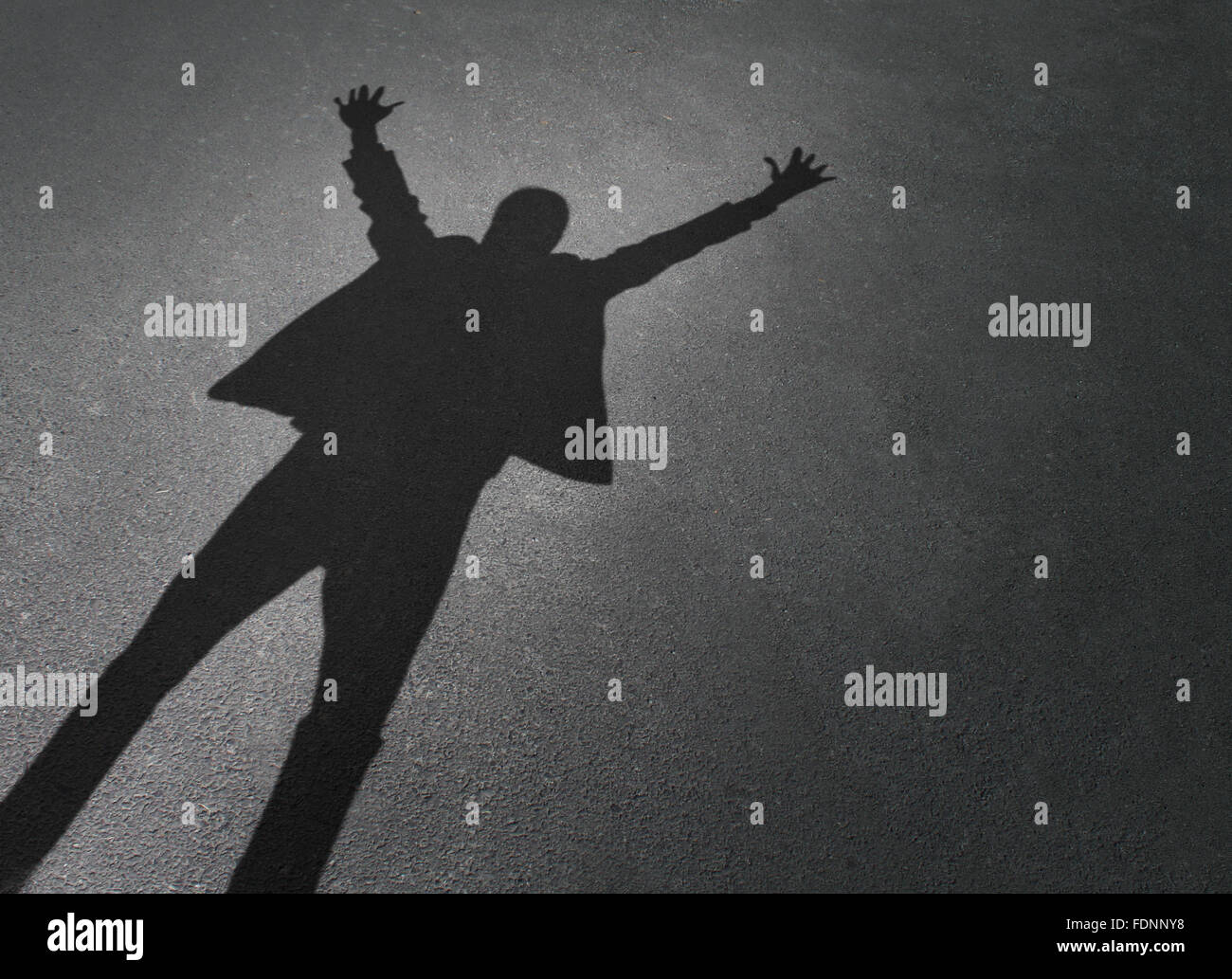 Business person corporate success as a cast shadow of a successful ...