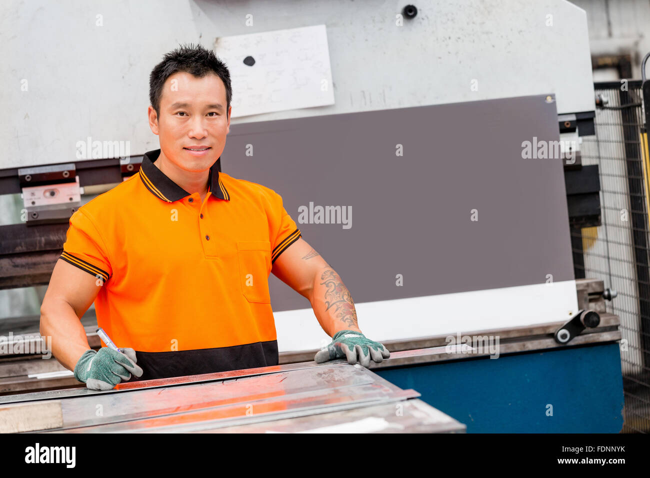 portrait of asian worker in production plant working on the factory ...