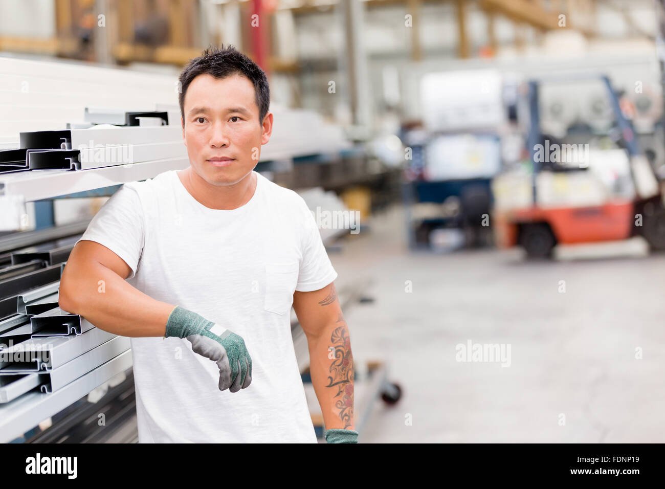 portrait of asian worker in production plant working on the factory ...