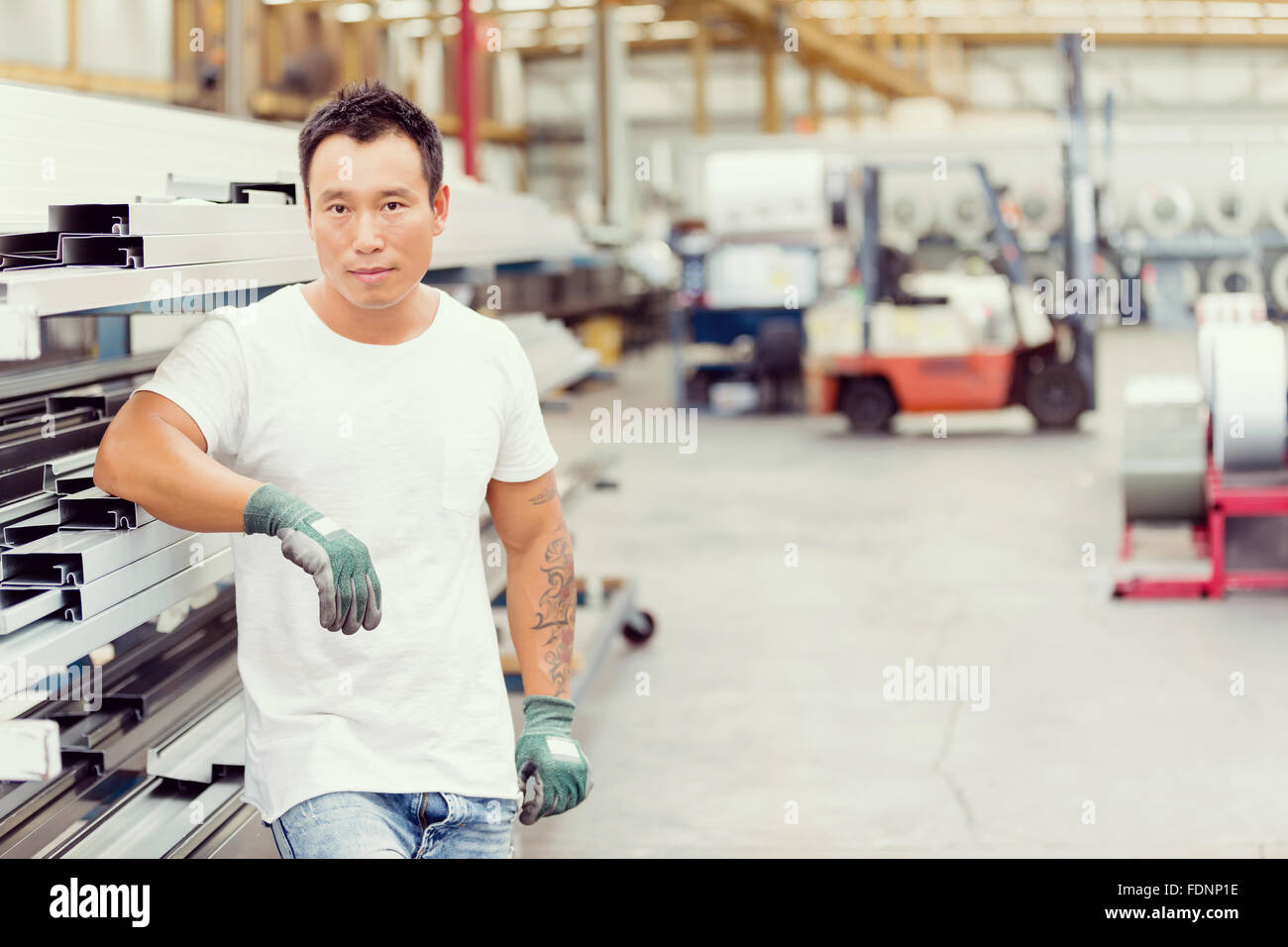 portrait of asian worker in production plant working on the factory ...