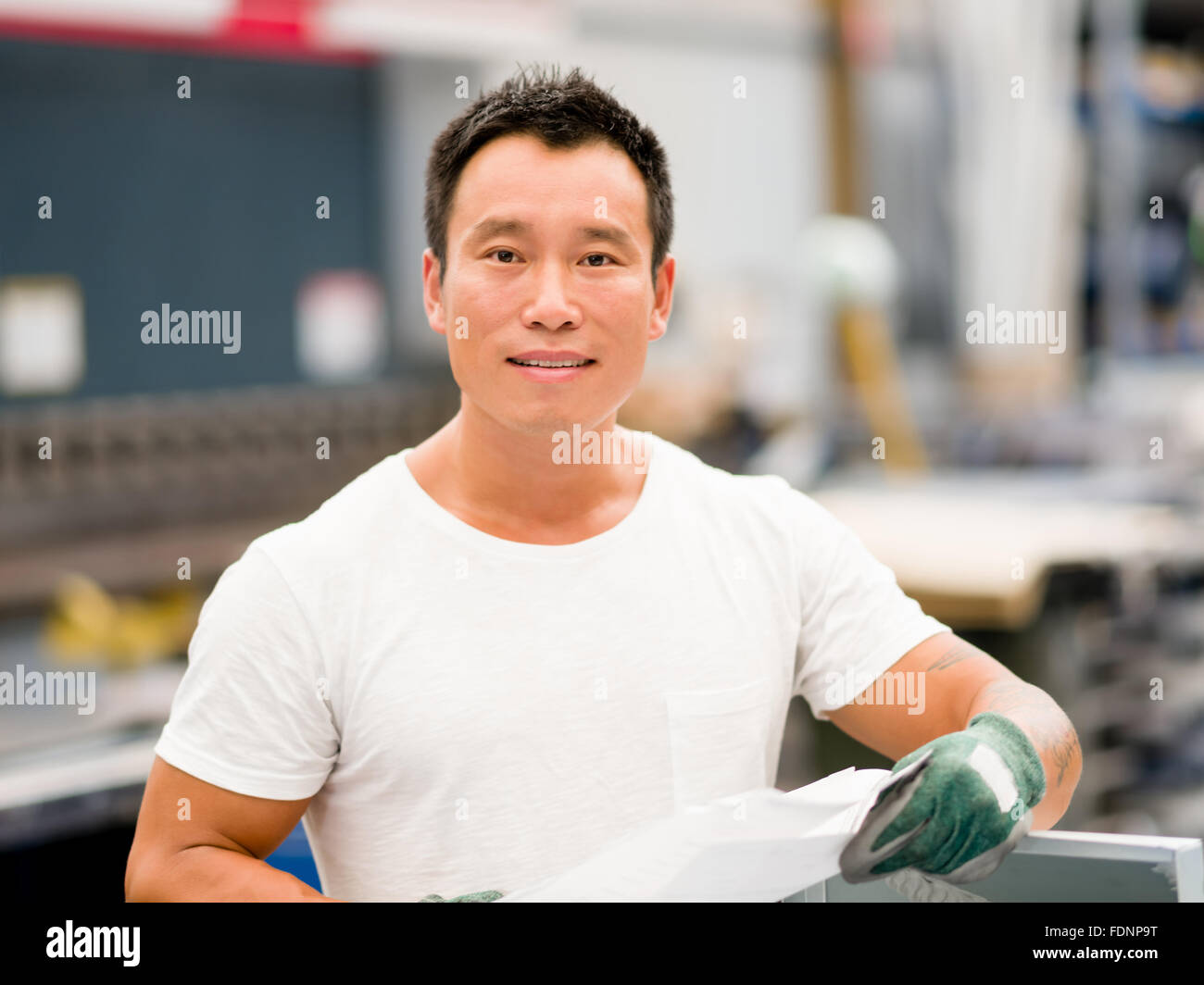 portrait of asian worker in production plant working on the factory ...