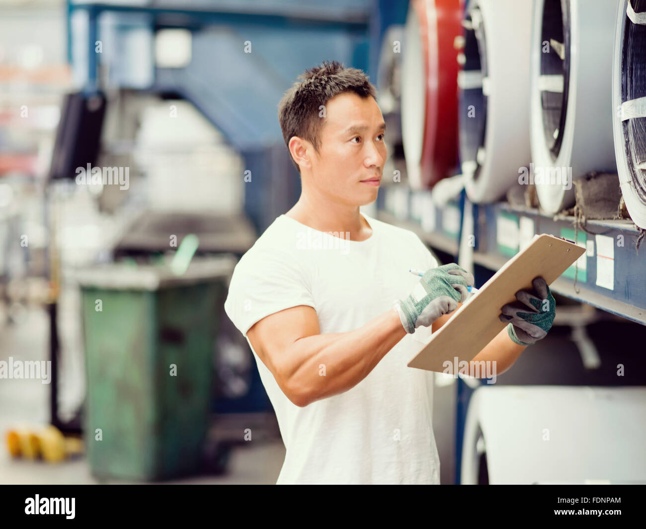 portrait of asian worker in production plant working on the factory ...
