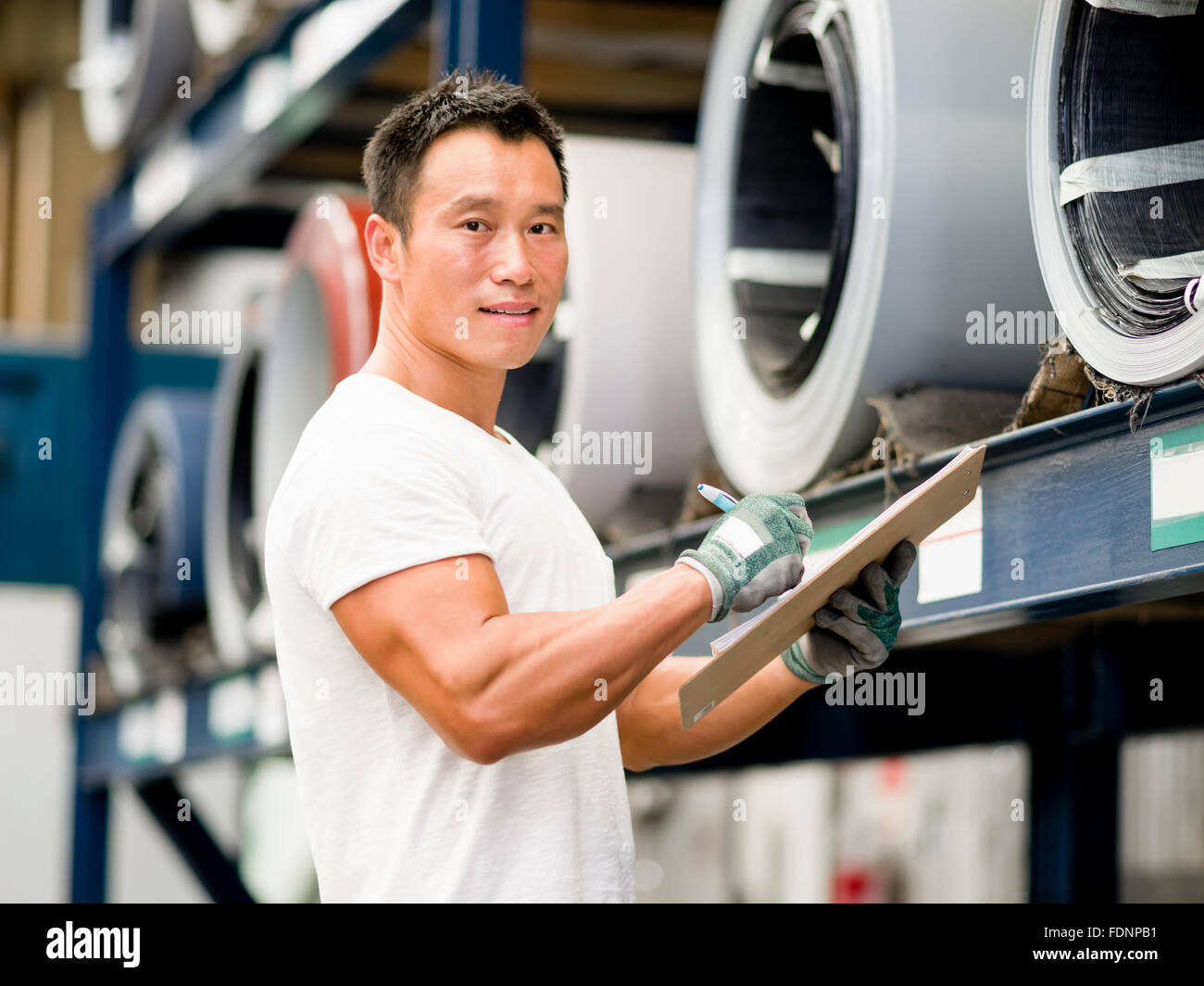 portrait of asian worker in production plant working on the factory ...