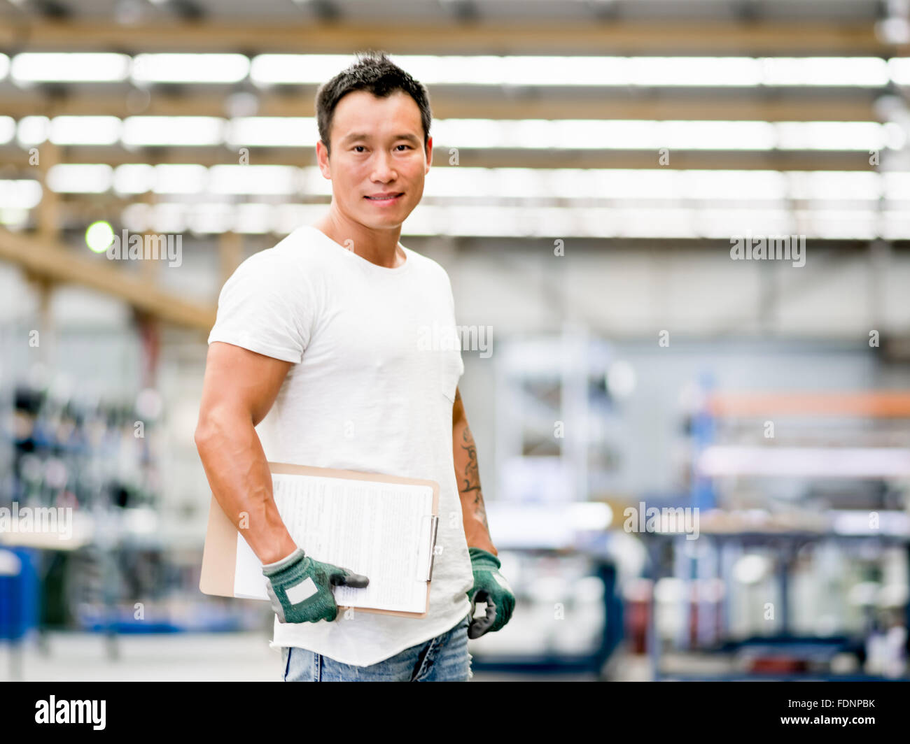 portrait of asian worker in production plant working on the factory ...