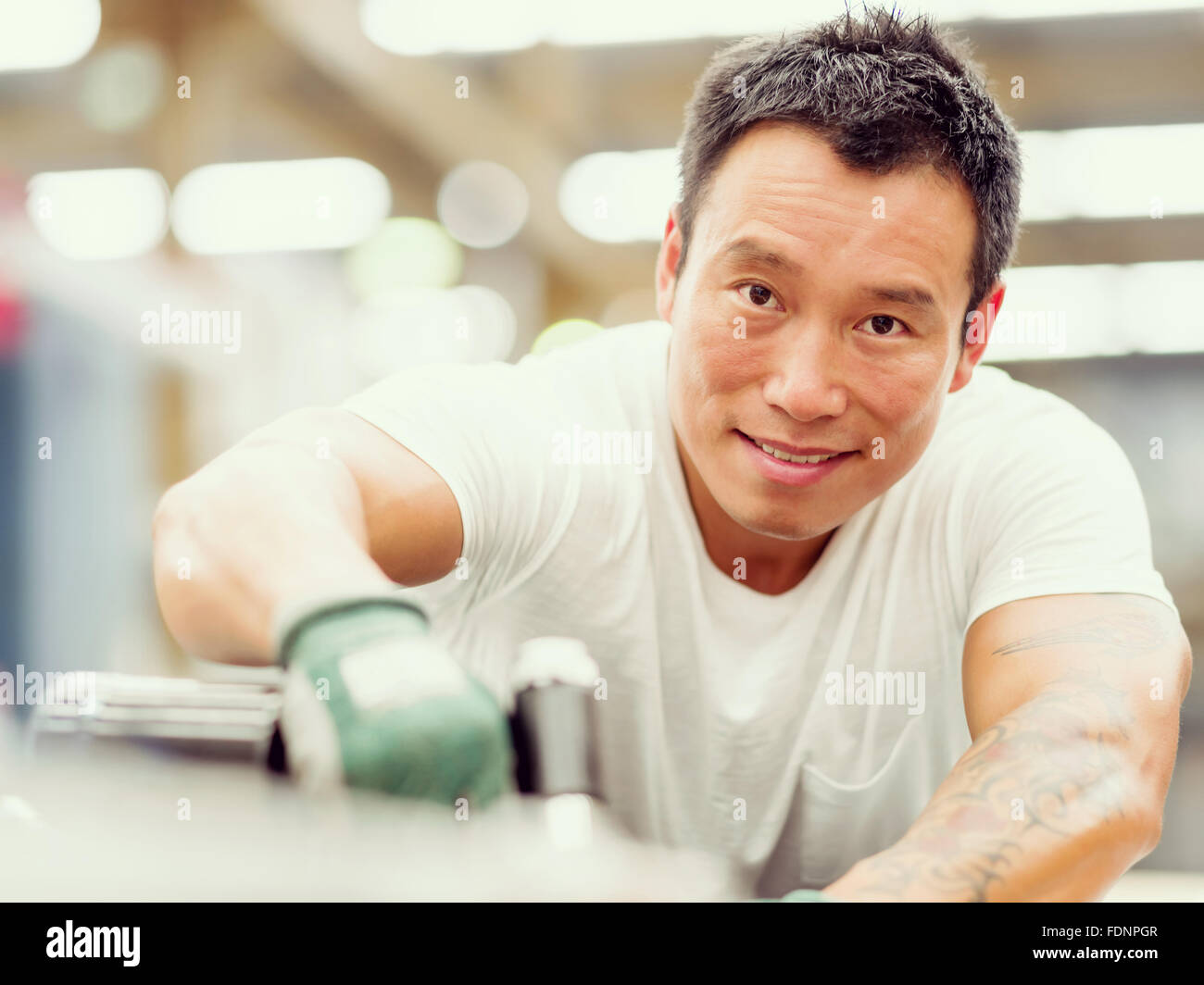 portrait of asian worker in production plant working on the factory ...