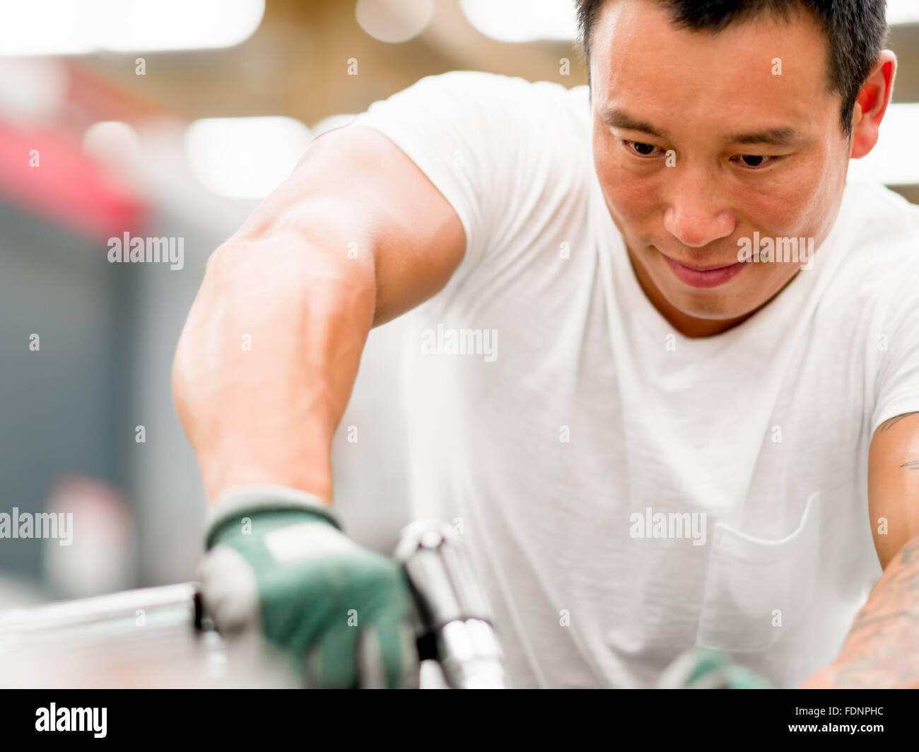 portrait of asian worker in production plant working on the factory ...