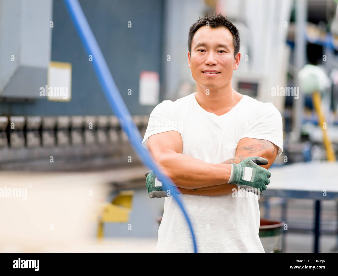 portrait of asian worker in production plant working on the factory ...