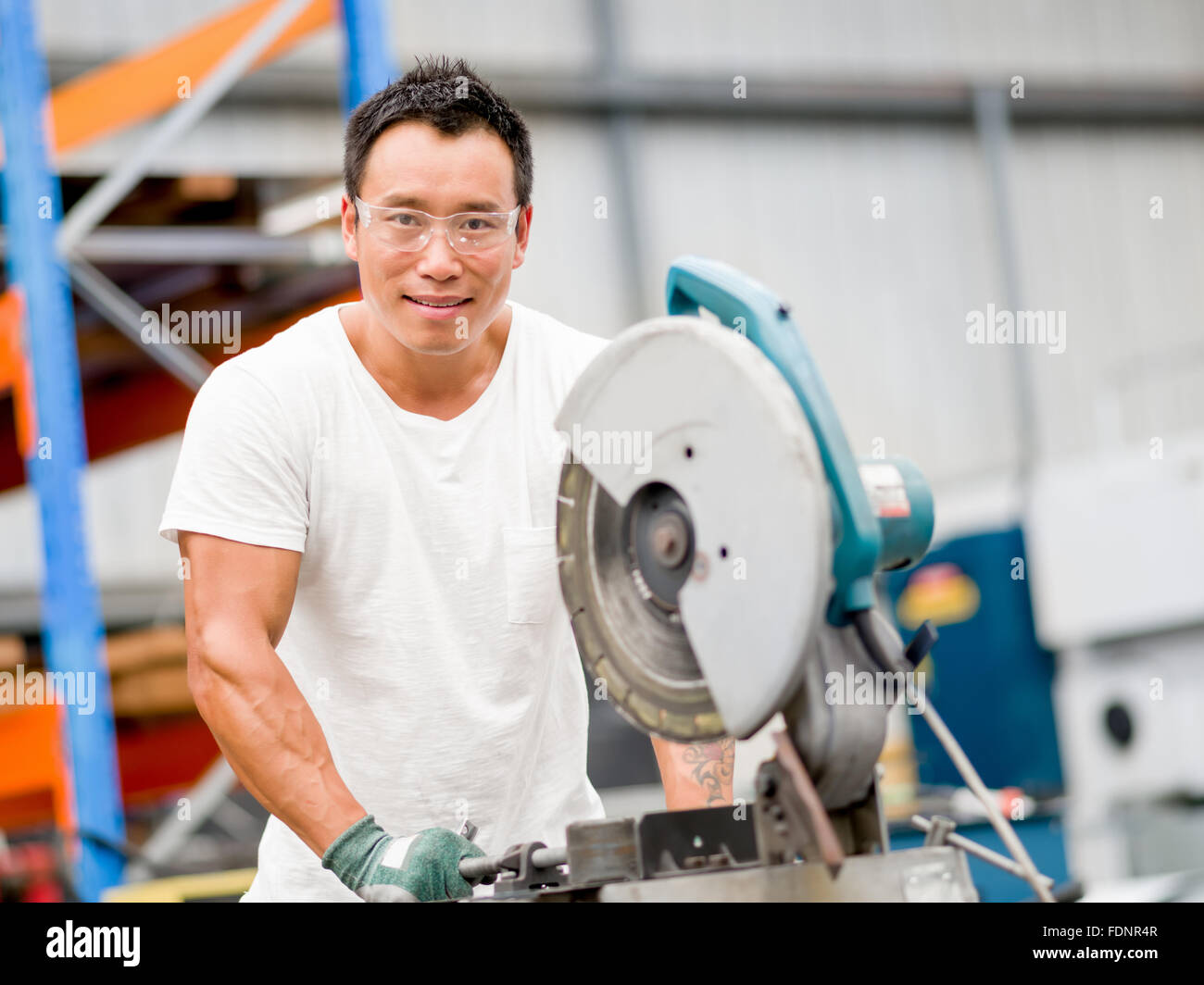 portrait of asian worker in production plant working on the factory ...