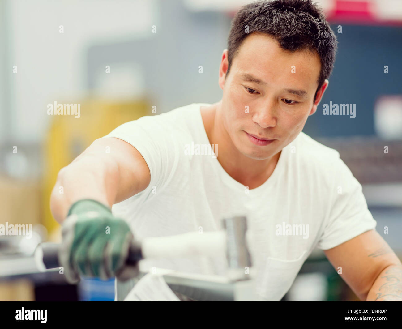 portrait of asian worker in production plant working on the factory ...