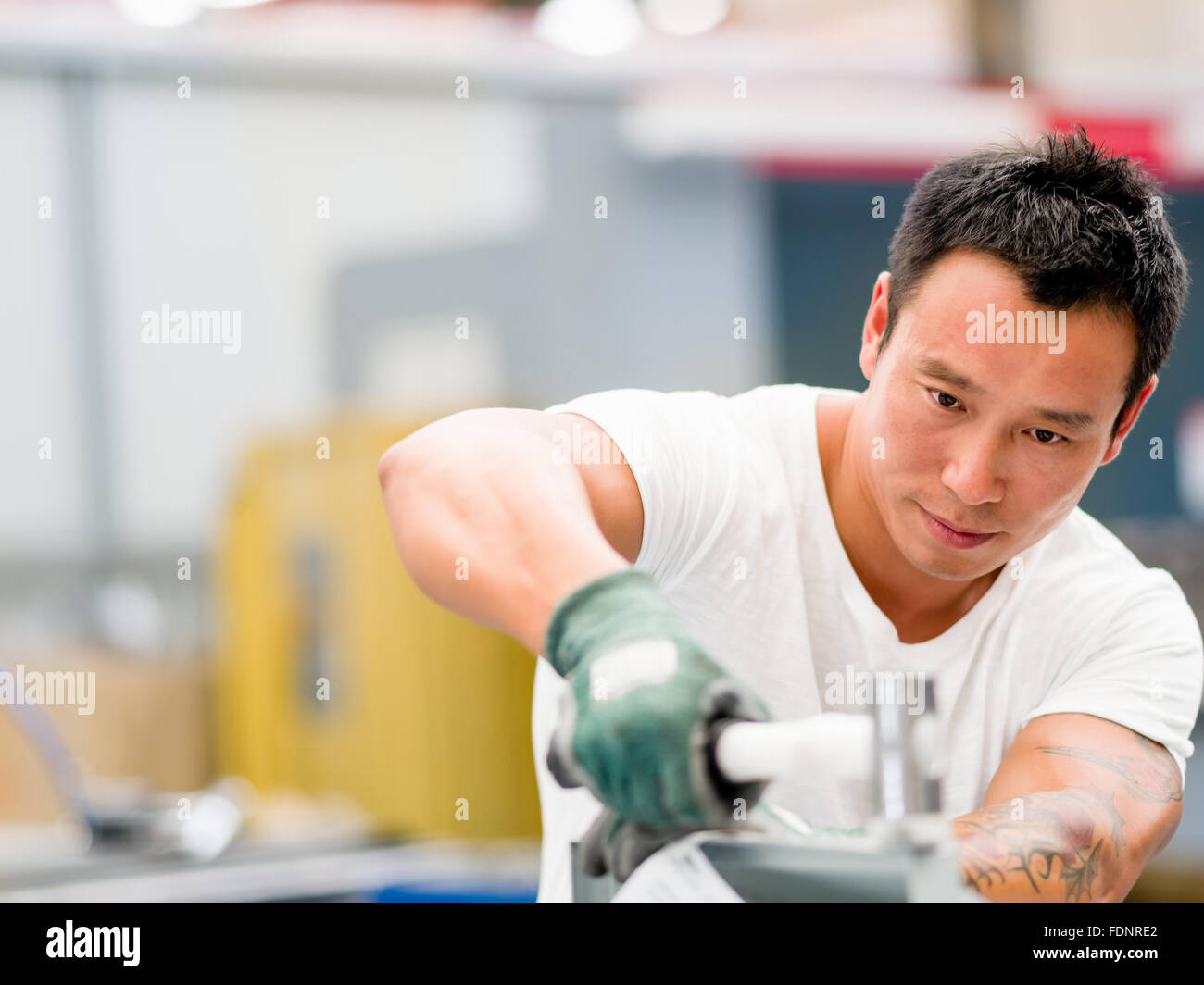 portrait of asian worker in production plant working on the factory ...