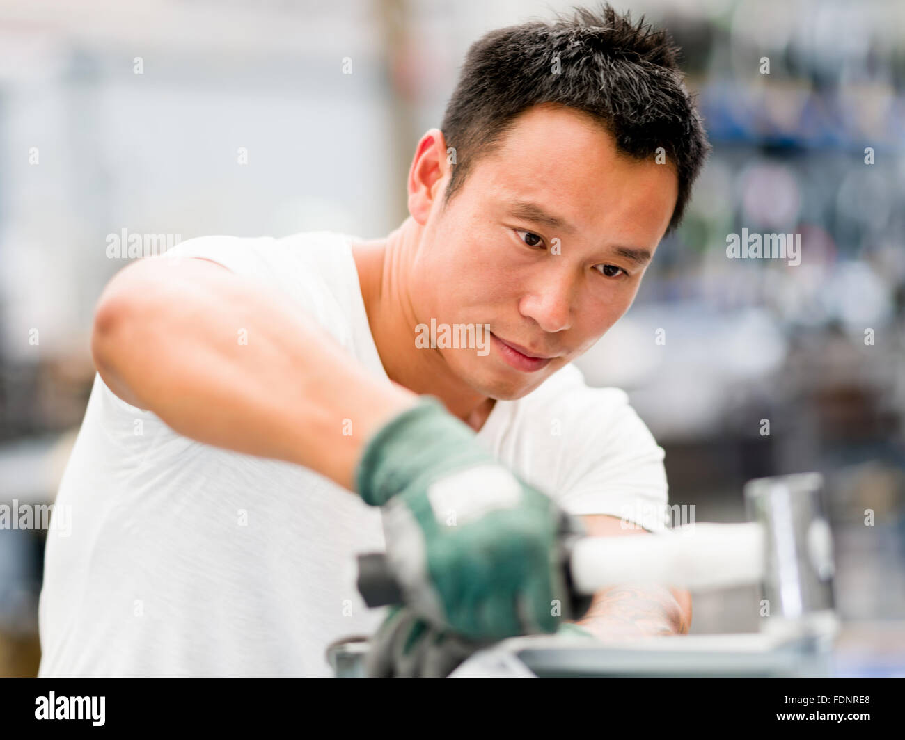 portrait of asian worker in production plant working on the factory ...
