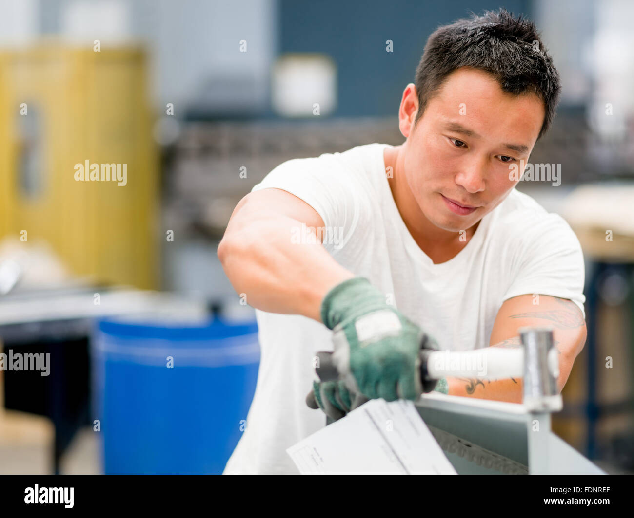 portrait of asian worker in production plant working on the factory ...