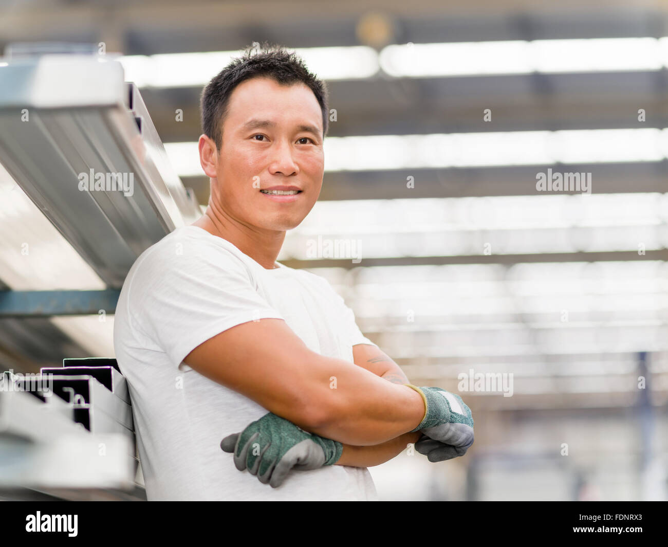 portrait of asian worker in production plant working on the factory ...