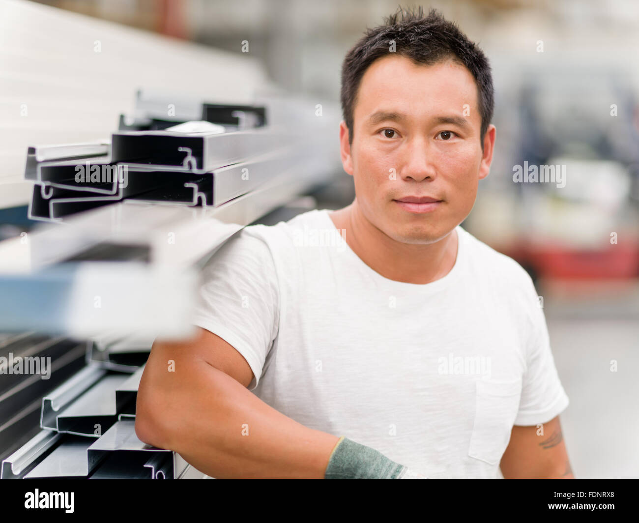 portrait of asian worker in production plant working on the factory ...