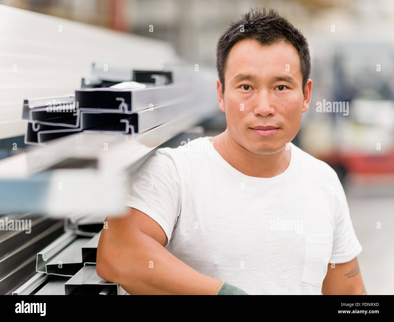 portrait of asian worker in production plant working on the factory ...