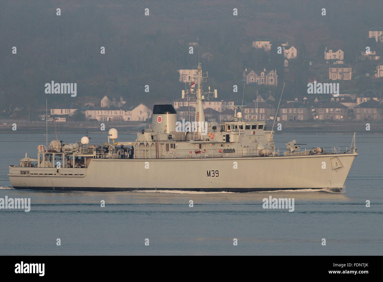 HMS Hurworth (M39), a Hunt-class minehunter of the Royal Navy, passes ...
