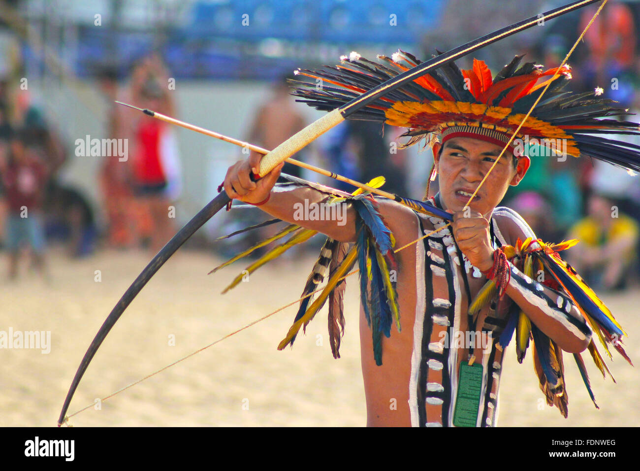 Brazilian Bororo indigenous men in native costume during archery ...