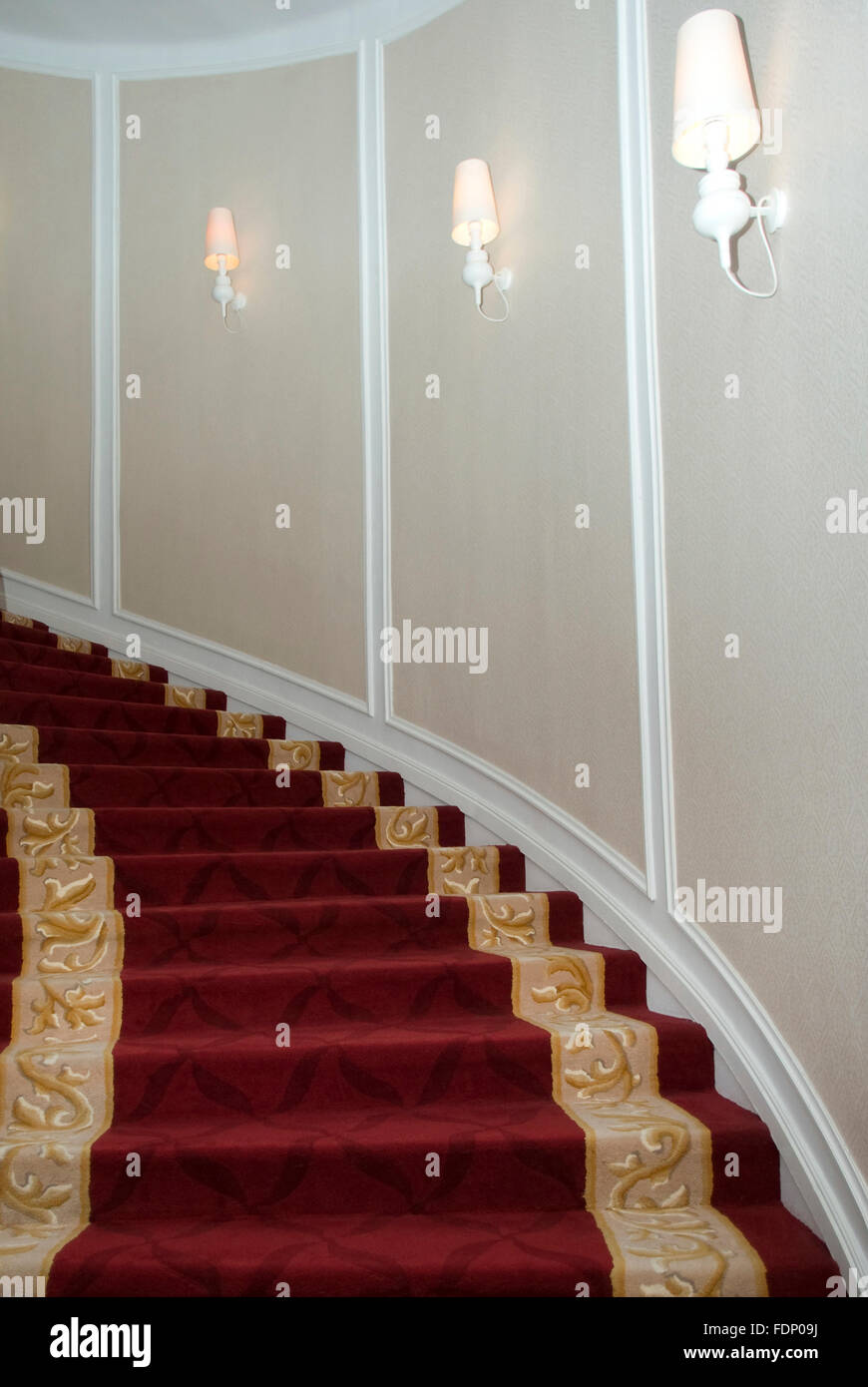 Staircase covered with red carpet Stock Photo - Alamy