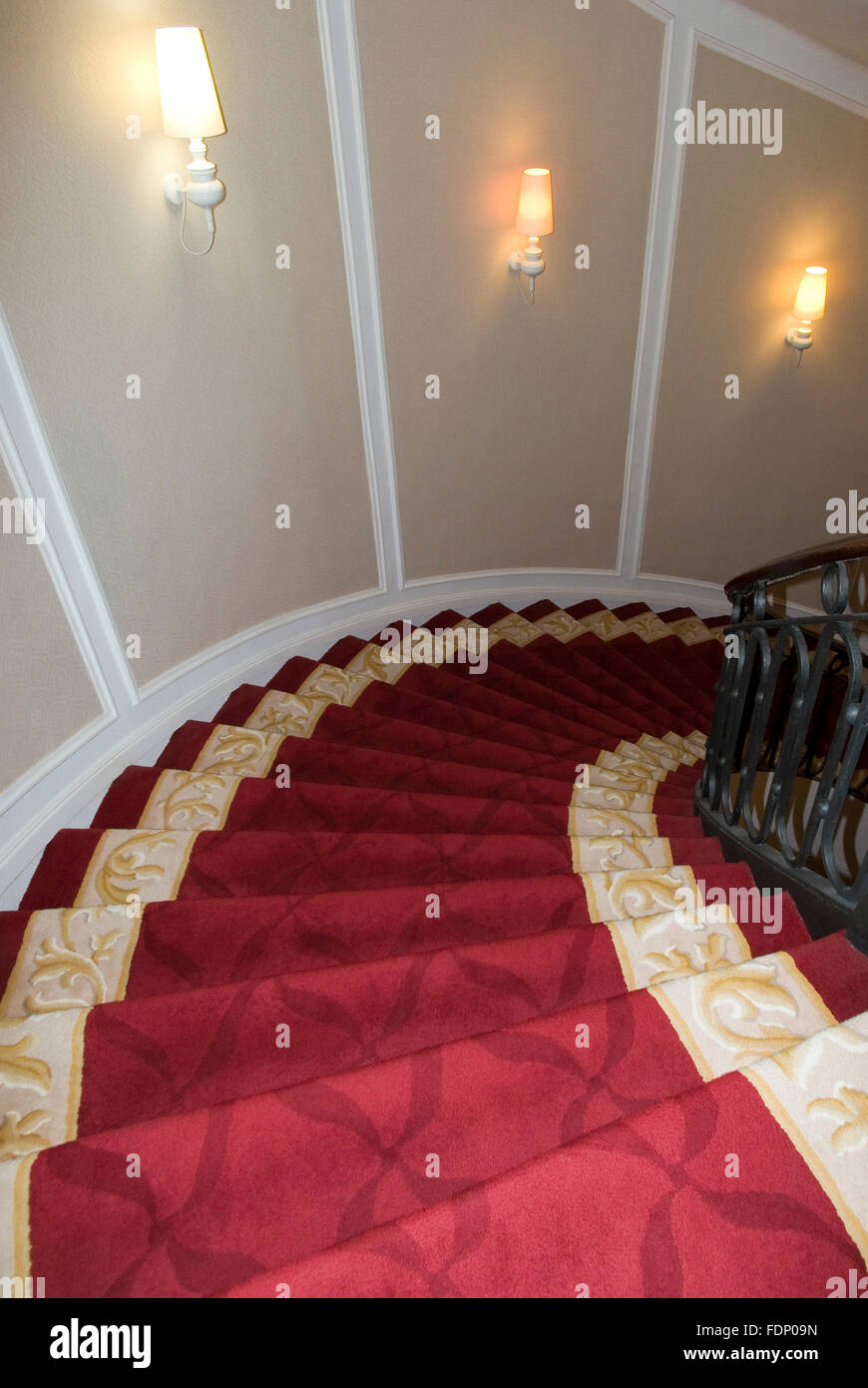 Staircase covered with red carpet Stock Photo - Alamy