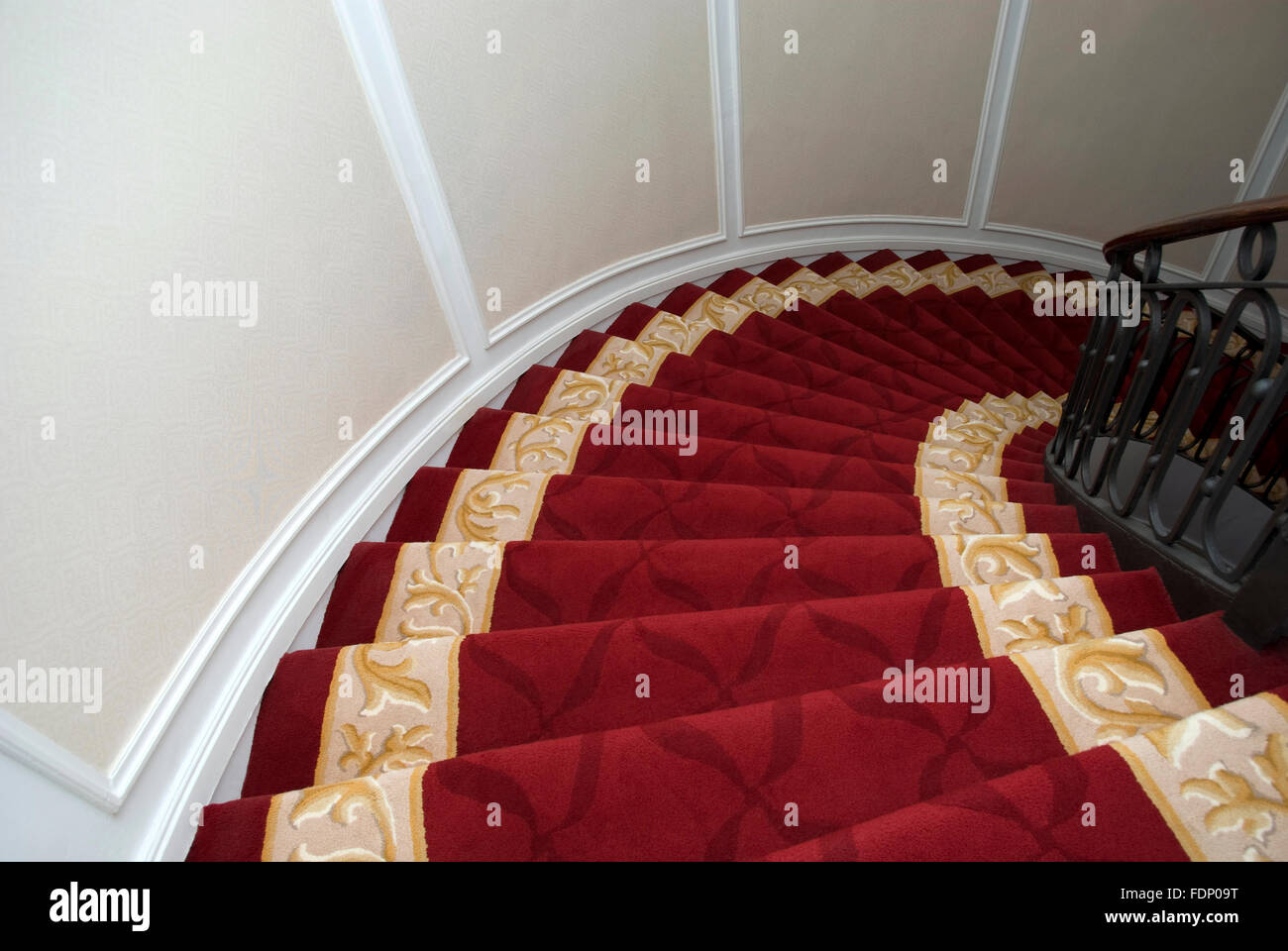 Staircase covered with red carpet Stock Photo - Alamy