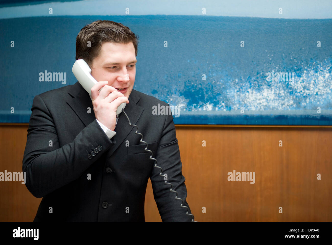 Staff at reception in hotel Stock Photo - Alamy