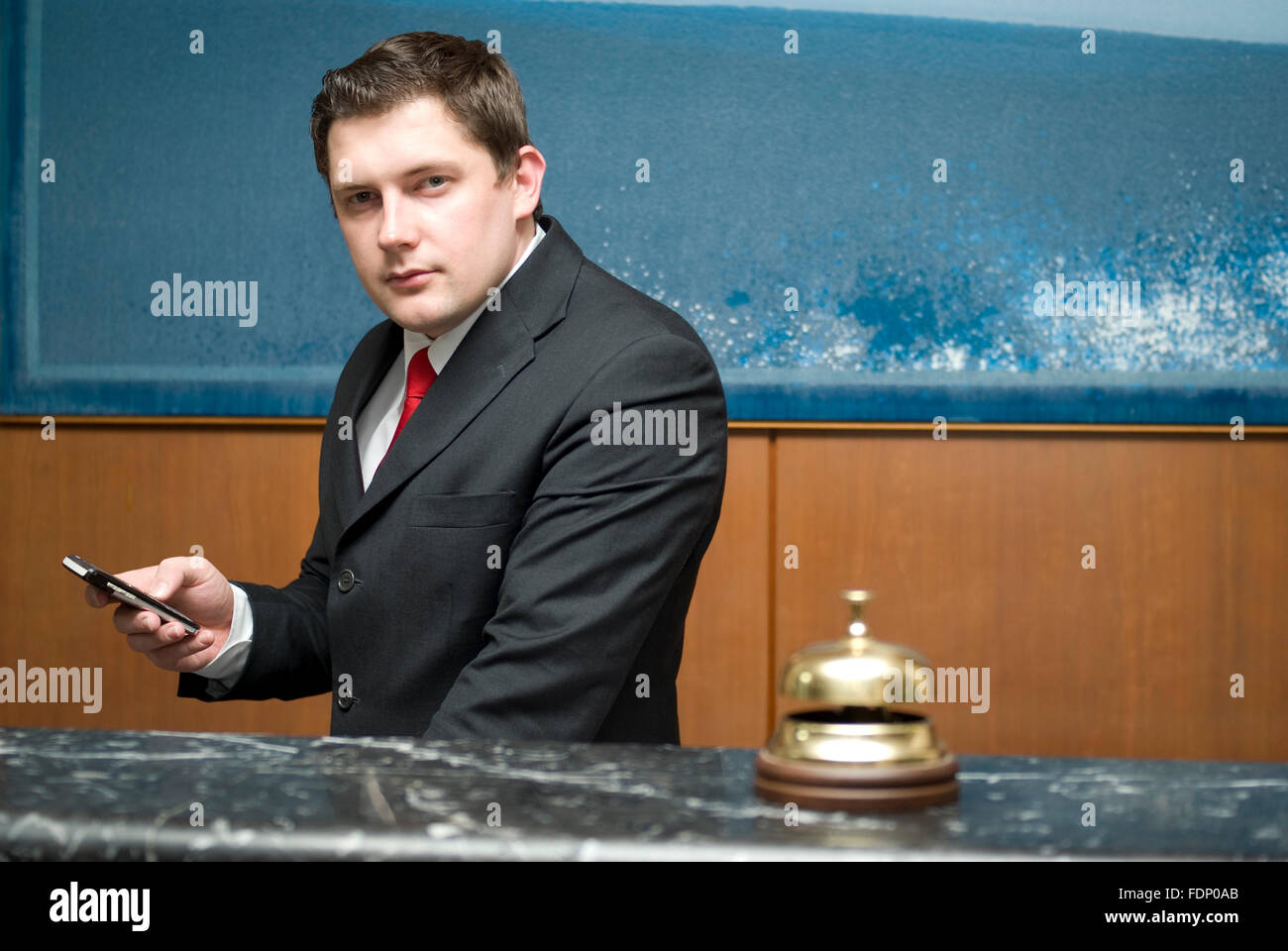 Staff at reception in hotel Stock Photo - Alamy
