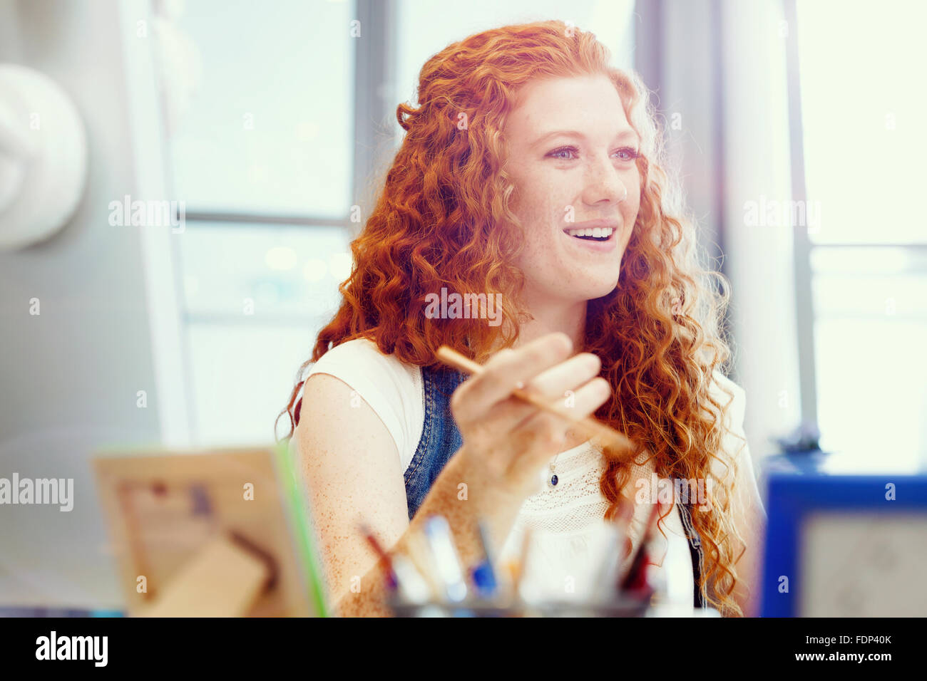 Young and pretty business woman working in office Stock Photo - Alamy