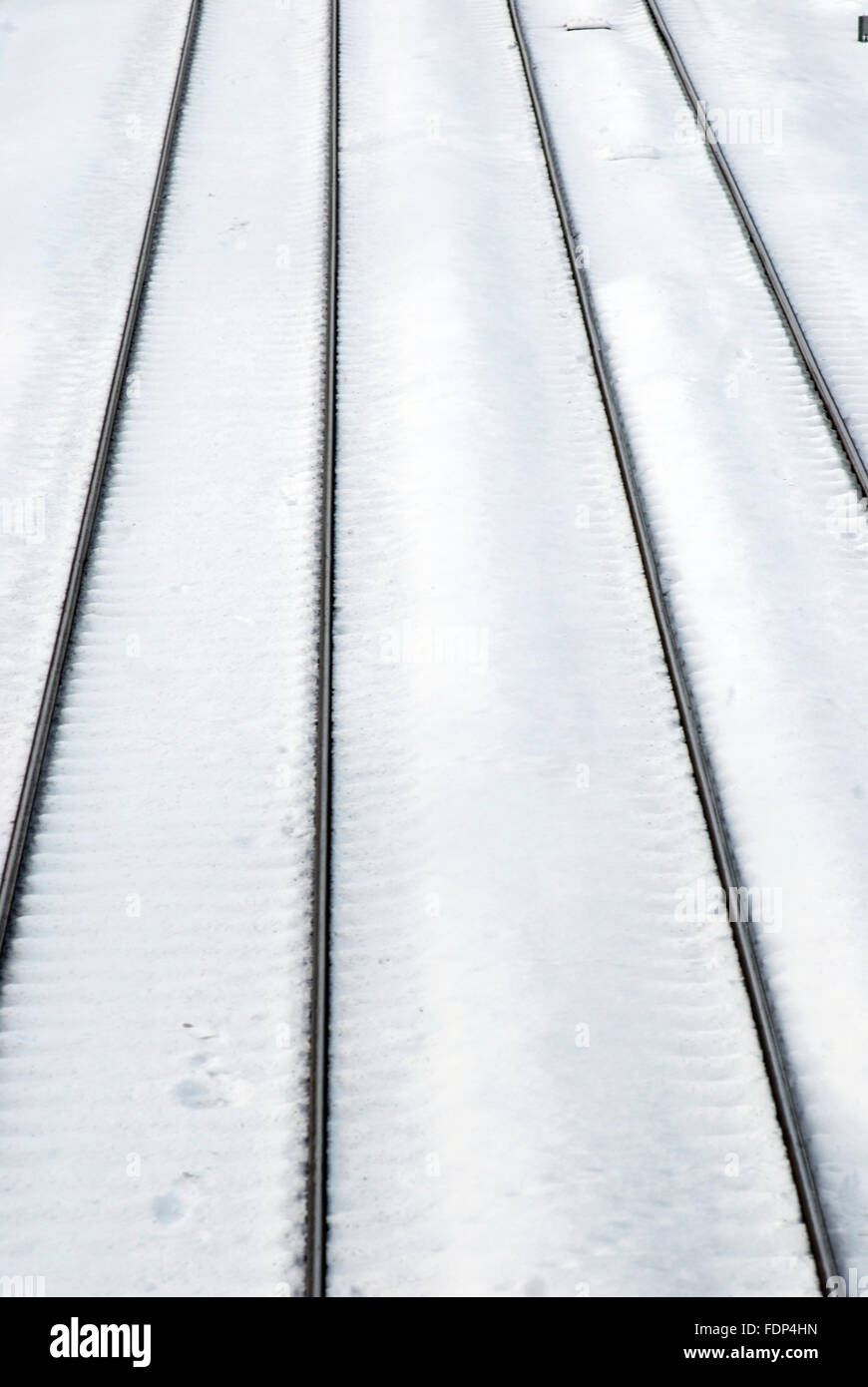 Rails covered in snow Stock Photo - Alamy