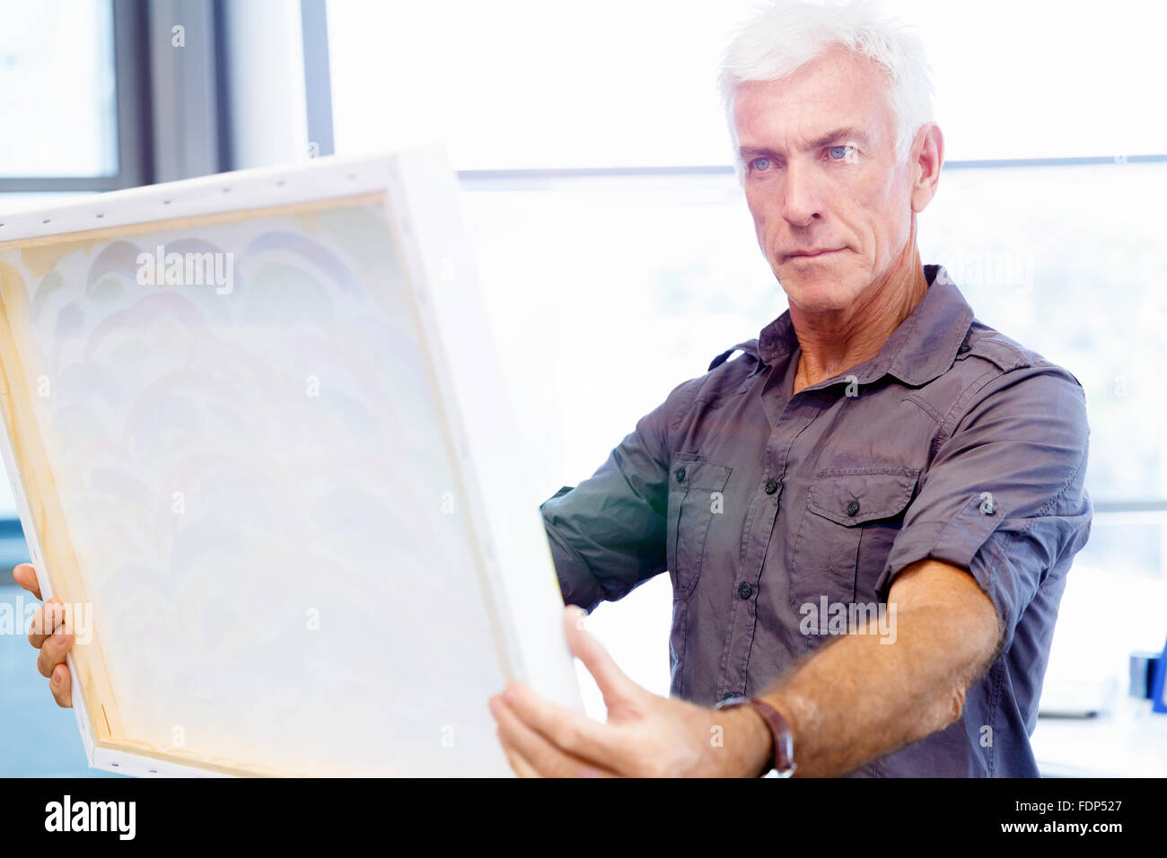 Man standing in a gallery and contemplating abstract artwork Stock ...