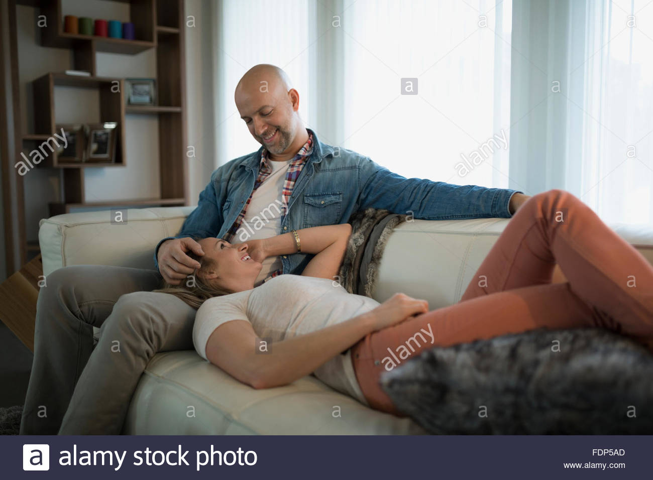 Woman sitting on man lap hi-res stock photography and images - Alamy