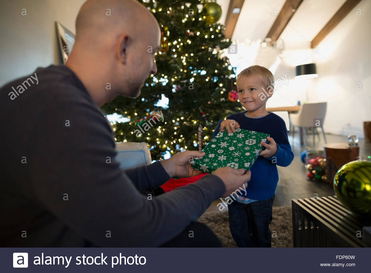 Father christmas giving gift hi-res stock photography and images - Alamy