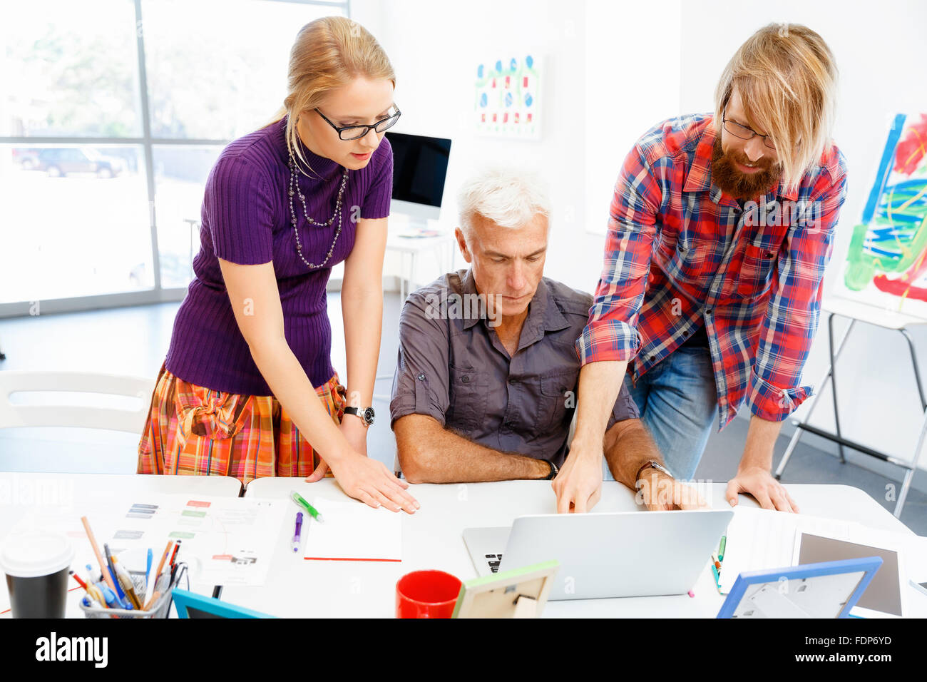 Business team working together in office Stock Photo - Alamy
